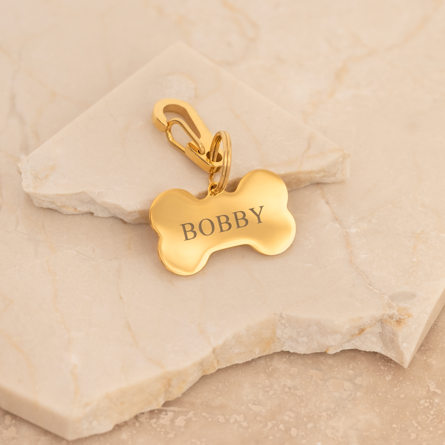Hondenpenning bot graveren kleur goud | Penningen | DRKS.nl
